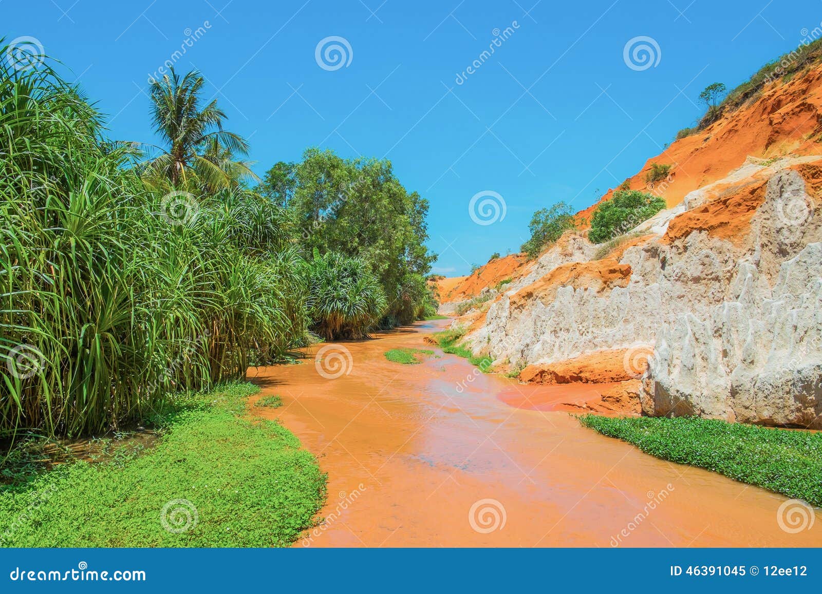 Red River and Colored Sandstone Stock Image - Image of mountain, green ...
