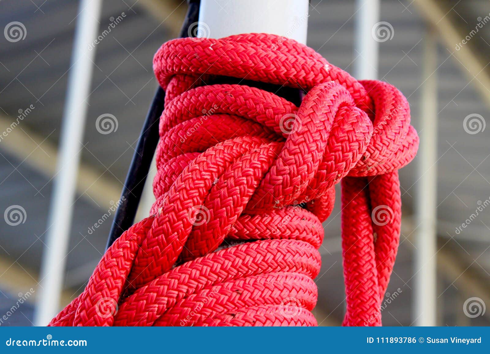 Red Rope Tied in Complex Knot Around Pole at Dock Stock Photo - Image ...