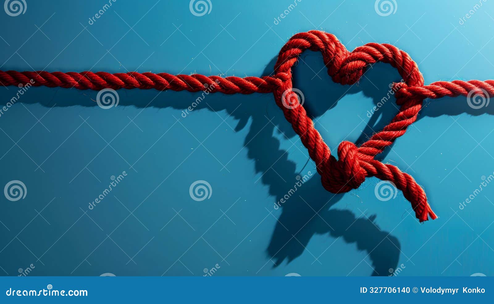 Red Rope Tied in a Heart Shape on Blue Background, Shadow Reflection ...