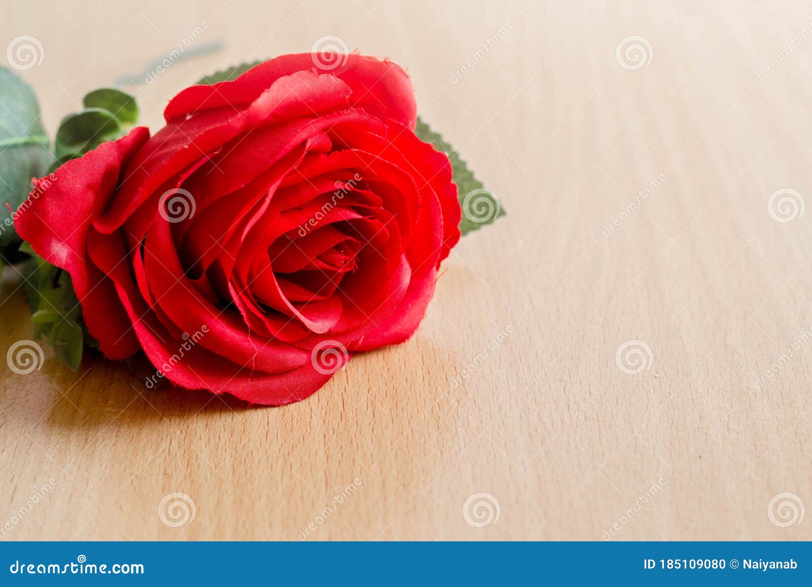 Red rose on wood table stock photo. Image of romantic - 185109080