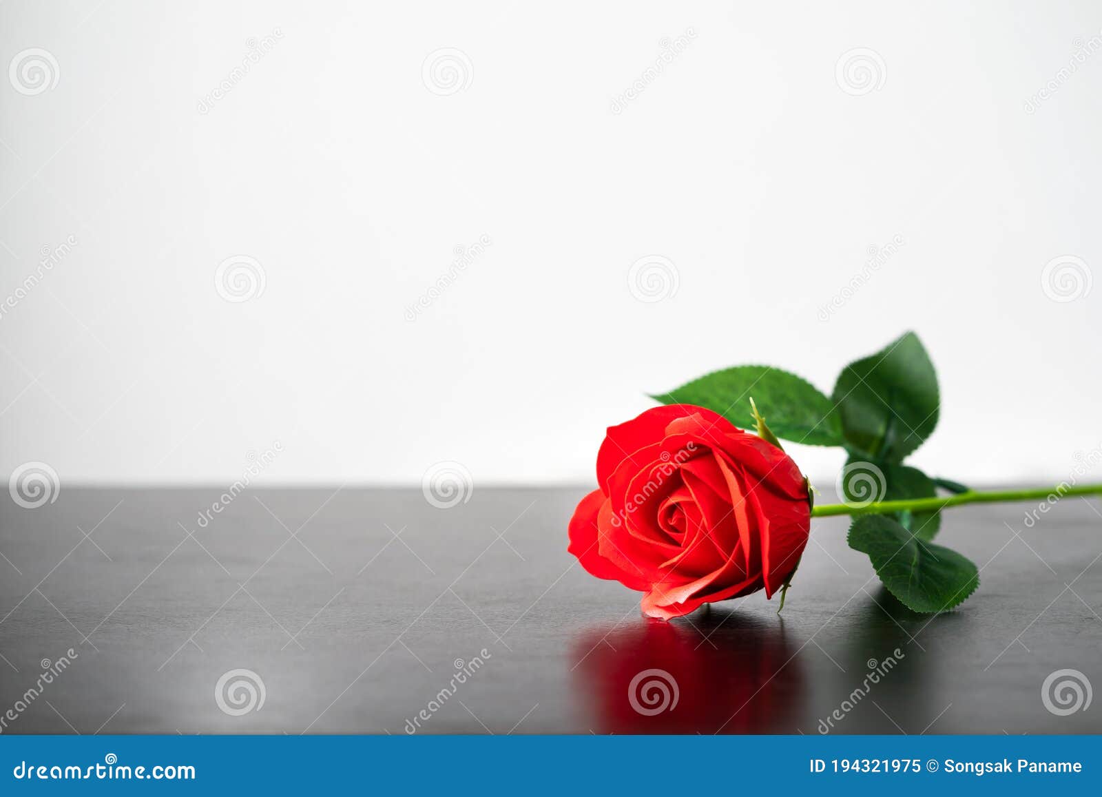Red rose on the wood table stock image. Image of romantic - 194321975