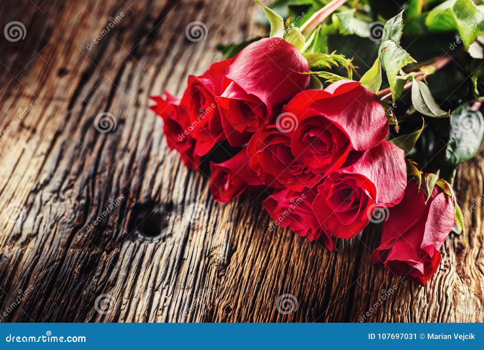 Red Roses. Bouquet of Red Roses Free Lying on Rustic Oak Table Stock ...