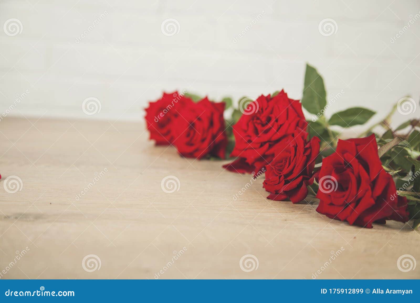 Red roses on desk stock image. Image of blossom, wallpaper - 175912899