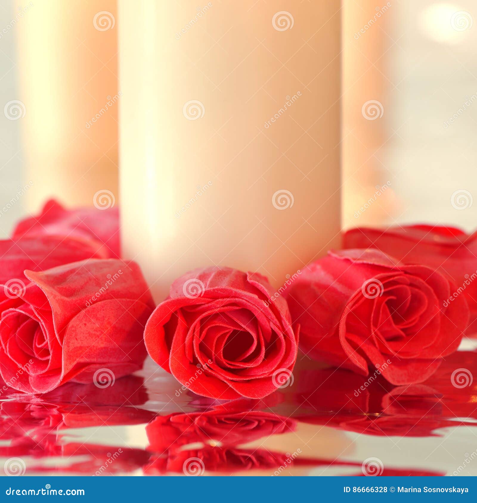 Red Roses with Reflection Around a Candle Stock Photo - Image of flower ...