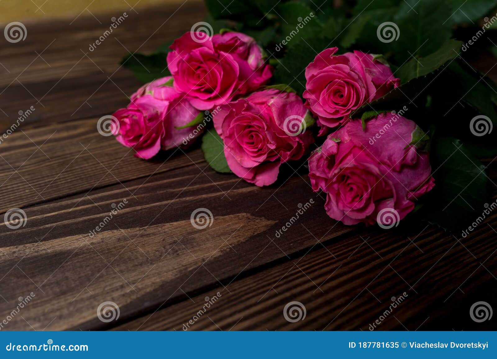 Red roses on the table stock image. Image of poster - 187781635