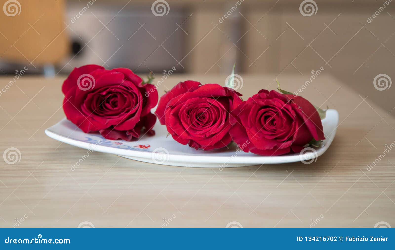 Red roses on table stock photo. Image of decoration - 134216702