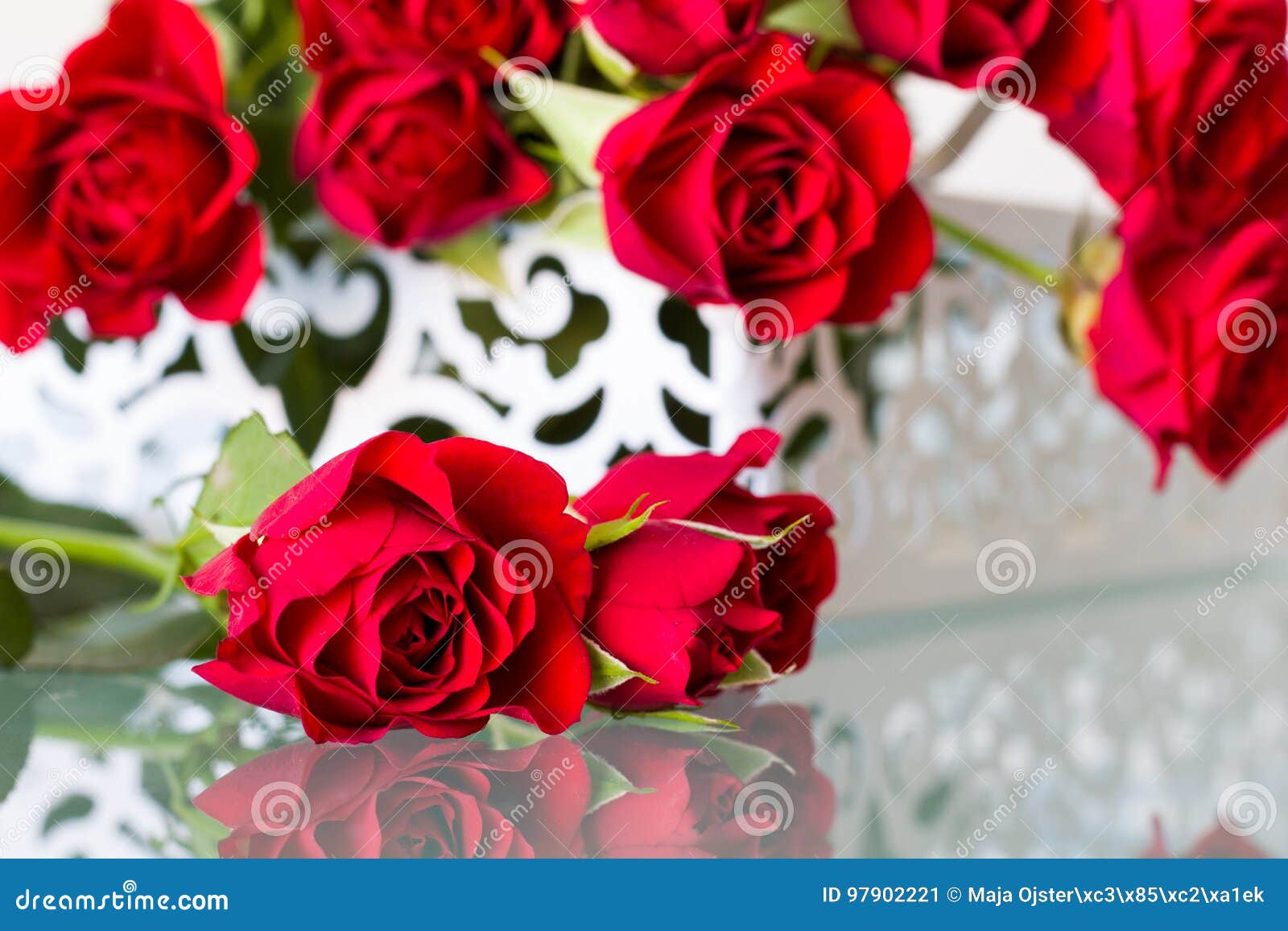 Red roses on table stock image. Image of background, anniversary - 97902221