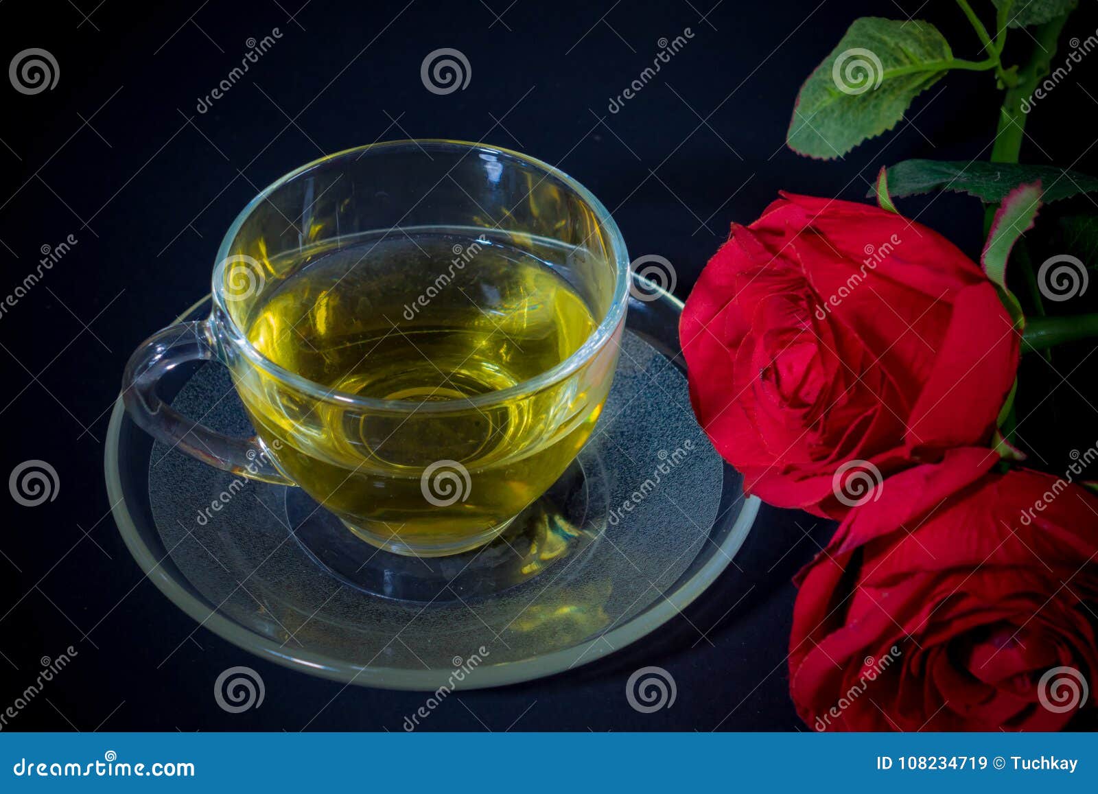 Red Roses and Tea in Glass stock image. Image of fruit - 108234719