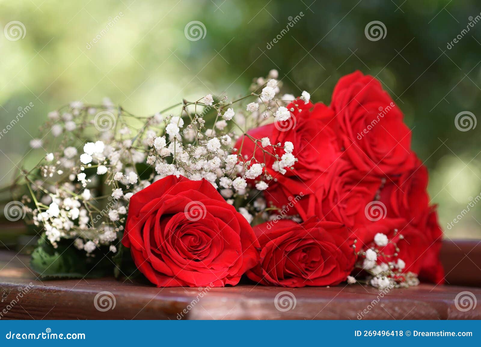 Red Roses with White Decorative Elements on Bouquet Thats on Table ...