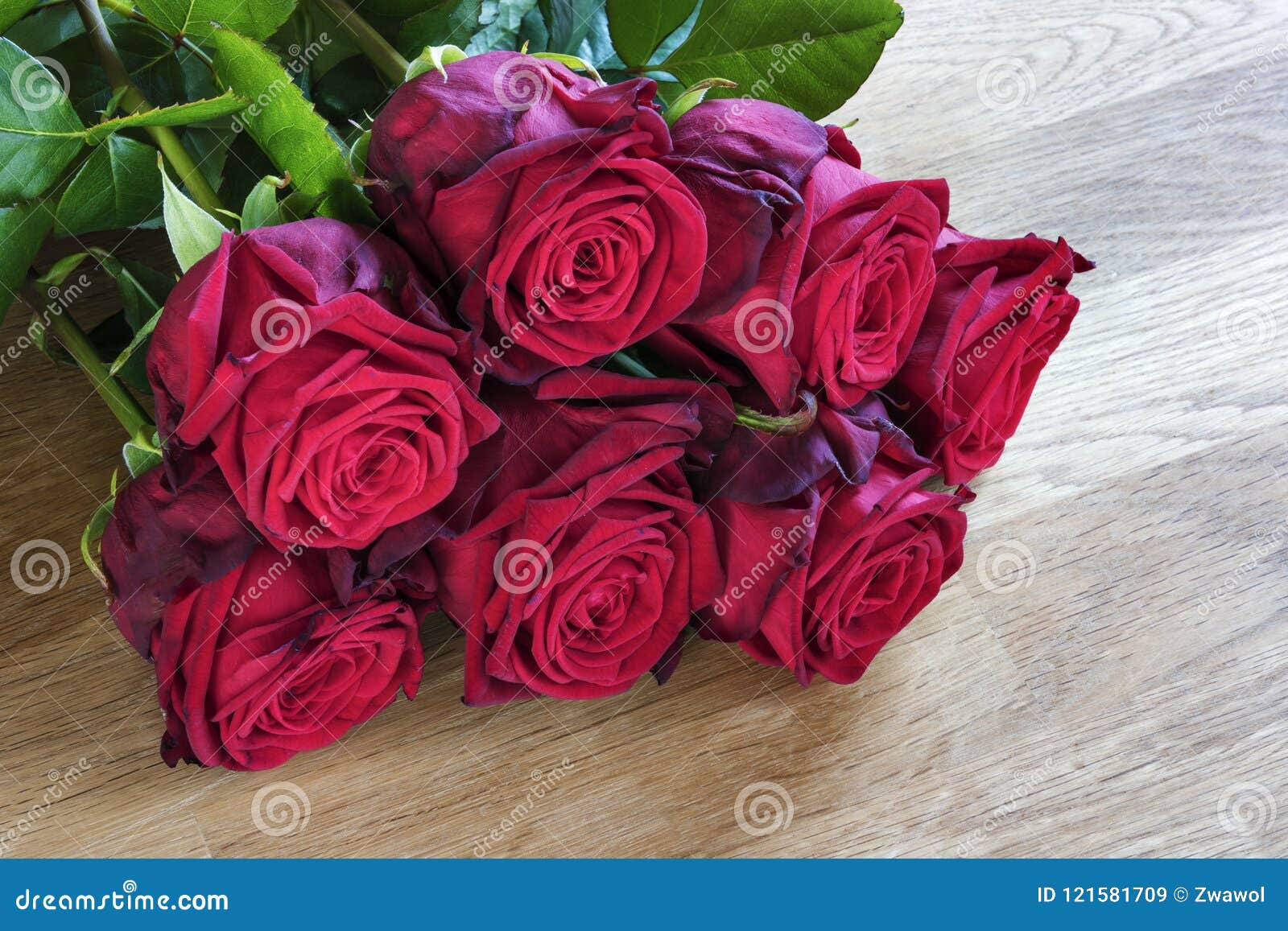 Red roses on table stock image. Image of space, wood - 121581709