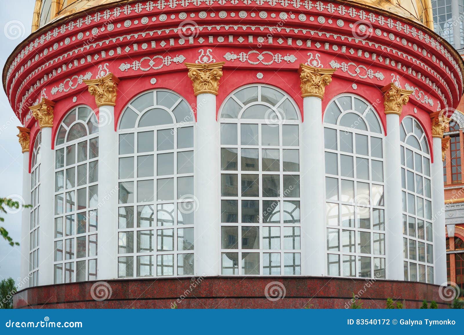 Red Round Building with Large Windows and Columns Stock Photo - Image ...