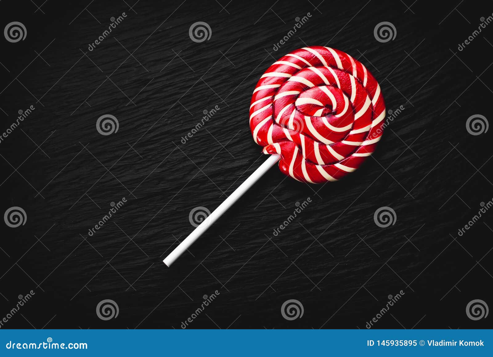 Red, Round Colored Lollipop on Black Background Stock Image - Image of ...