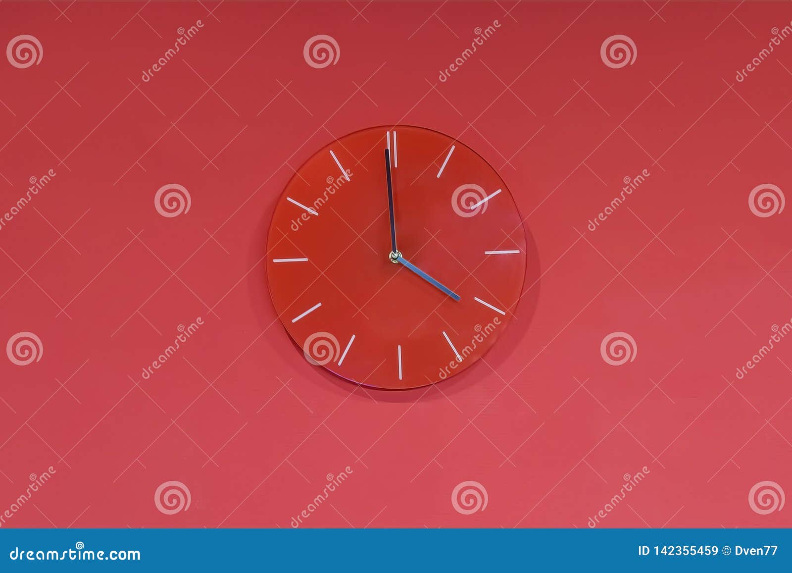 Red Round Modern Analog Glass Clocks Hang on a Red Wall. Shows the ...
