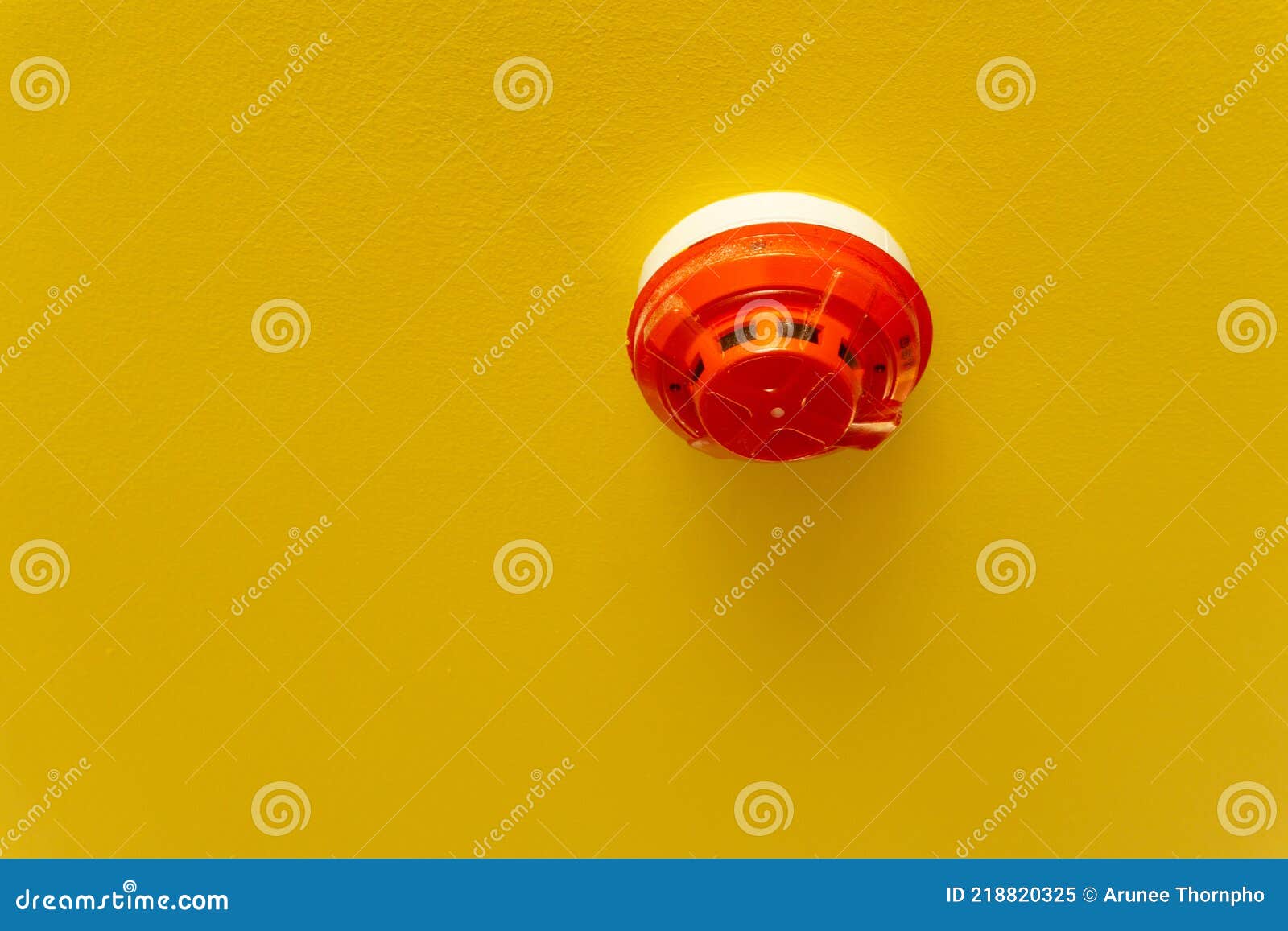 Red Round Smoke Detectors Provided on Yellow Ceiling Background Stock ...