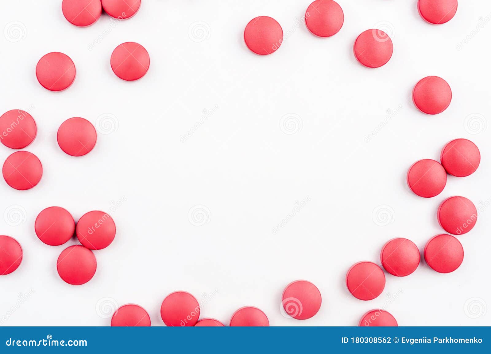 Red Round Tablets on a White Background with a Copyspace Stock Photo ...