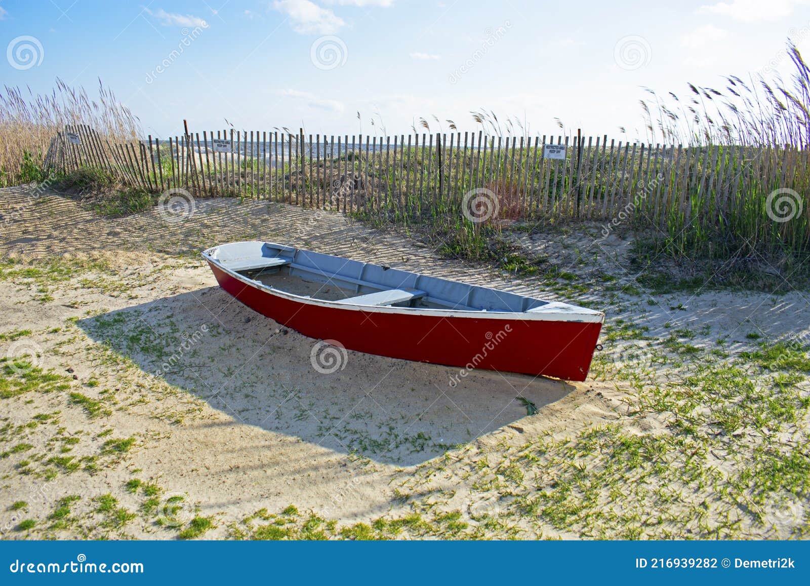 Red Rowboat on Sand stock photo. Image of dunes, daylight - 216939282