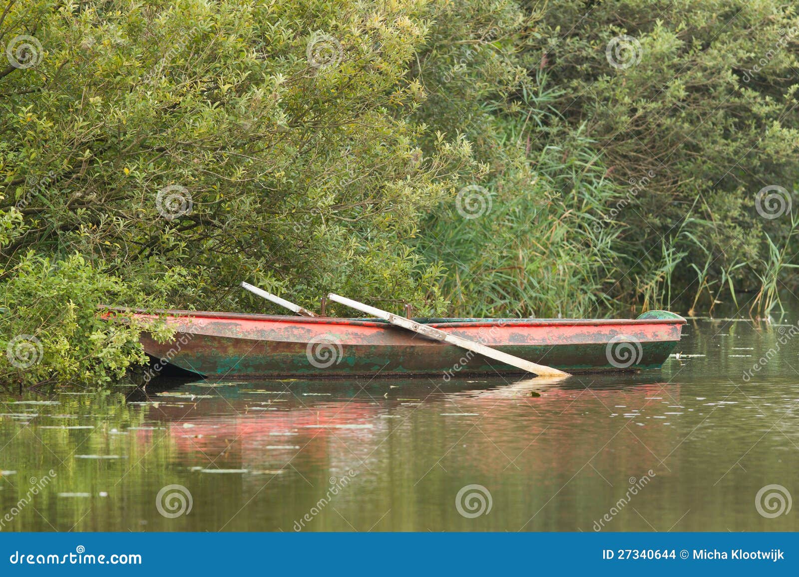 Red rowing boat on lake stock photo. Image of lake, reflection - 27340644