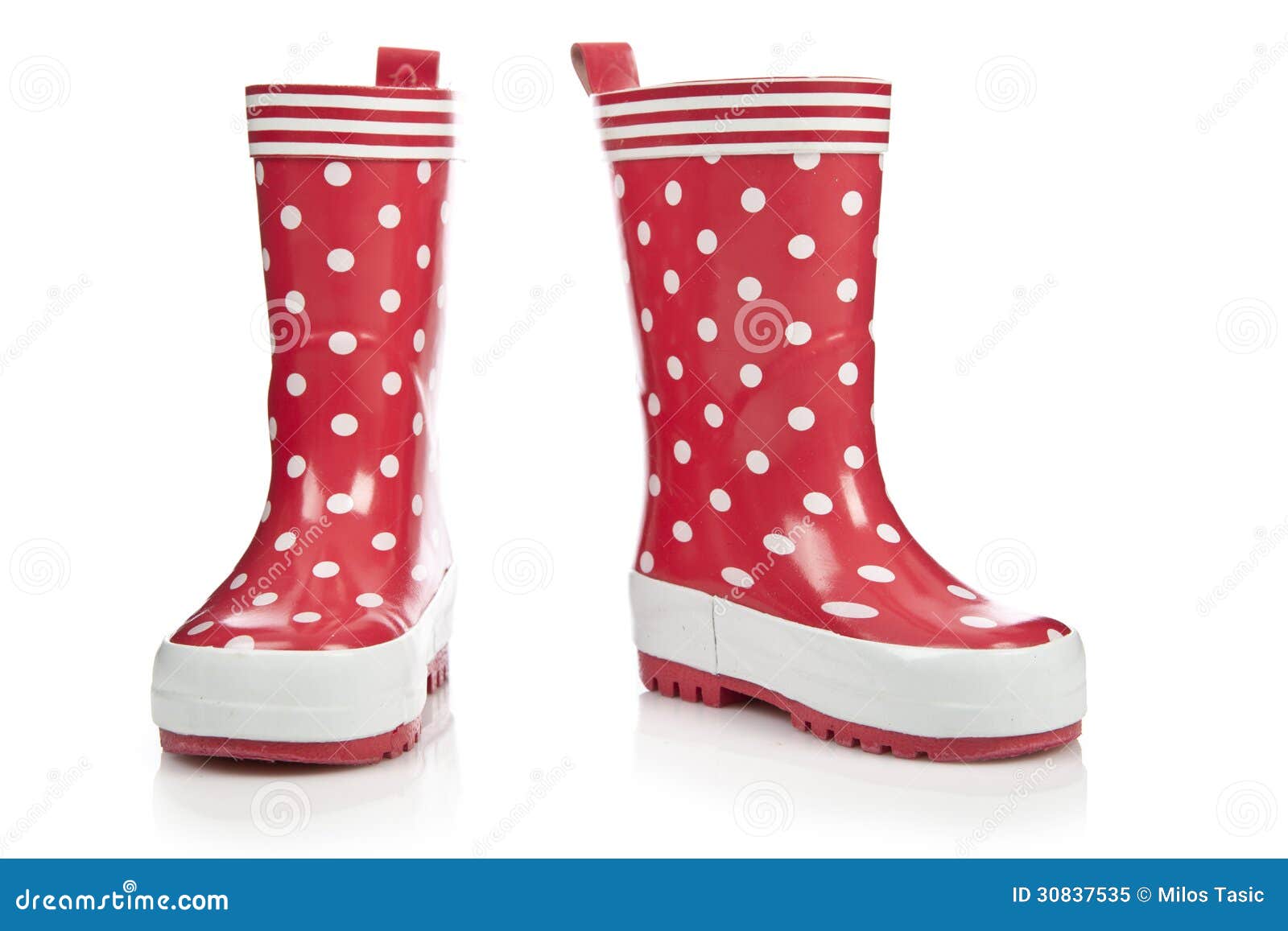 Red Rubber Boots Are Jumping Into A Big Puddle Royalty-Free Stock ...