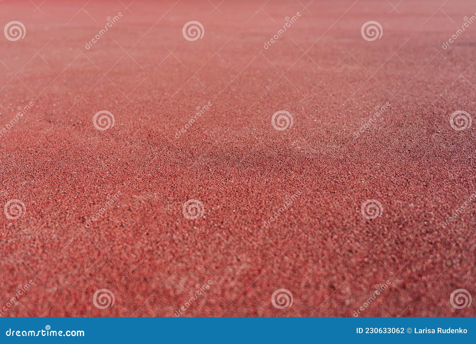 Red Rubber Coating Made of Recycled Rubber Chips on the Sports Field ...