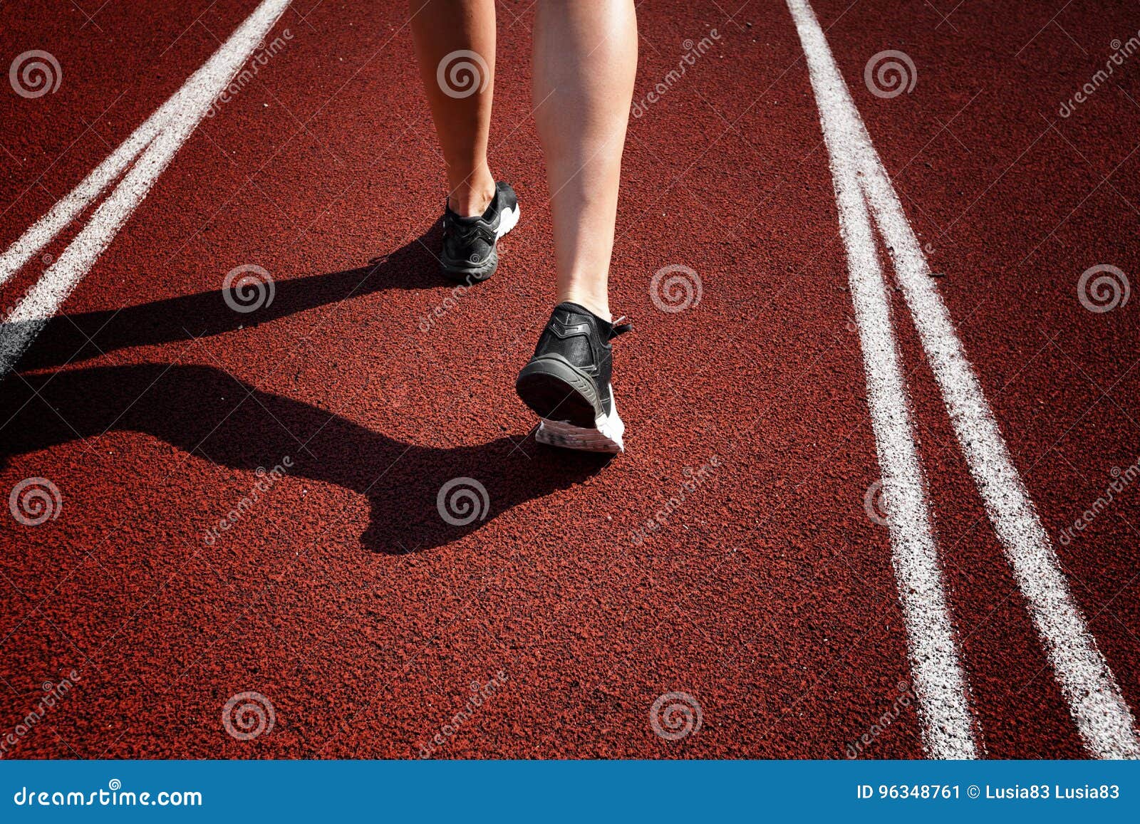 Red Running Track with Female Runner, Close Up on Legs Stock Image ...