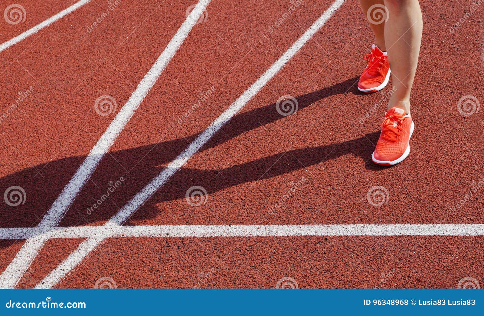 Red Running Track with Female Runner, Close Up on Legs Stock Photo ...