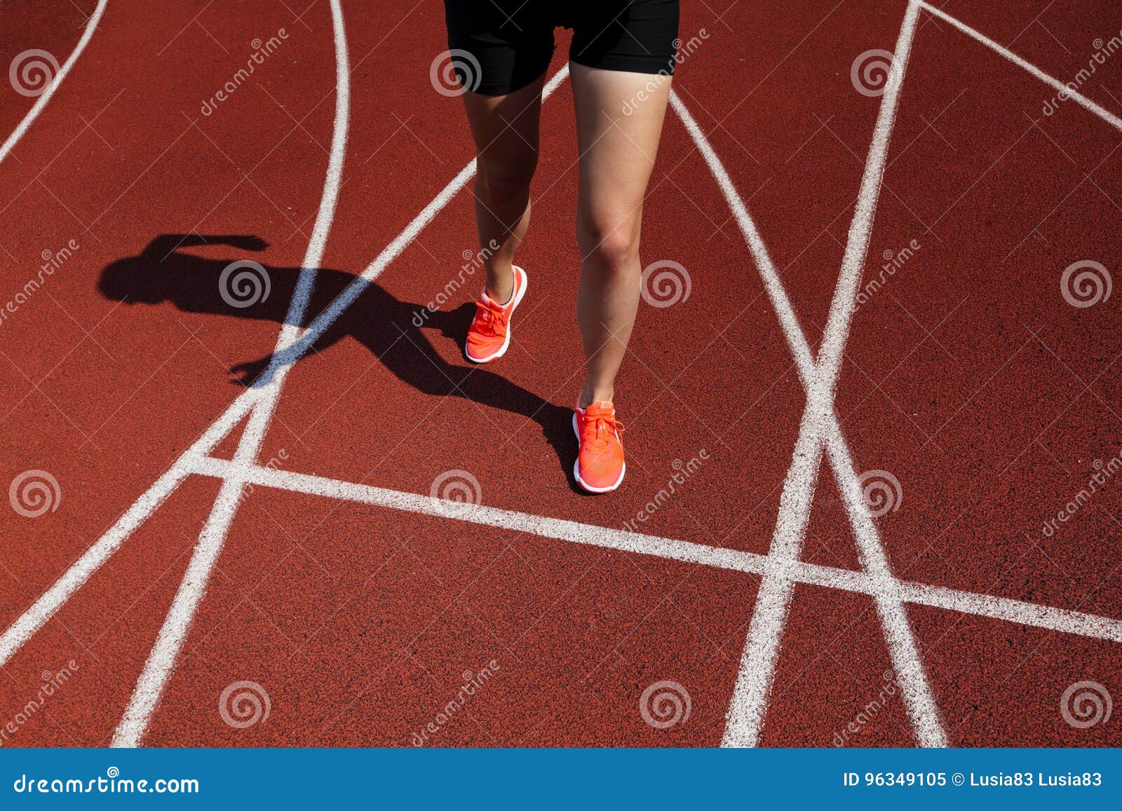 Red Running Track with Female Runner, Close Up on Legs Stock Image ...