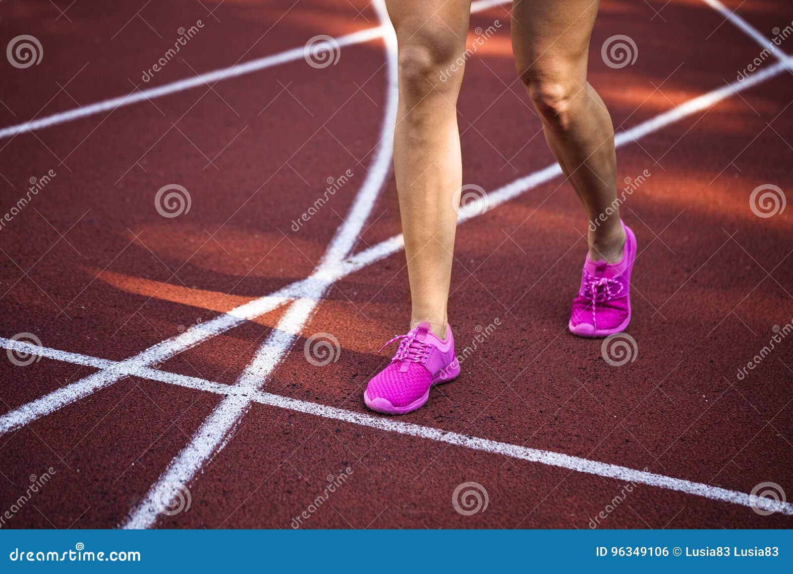 Red Running Track with Female Runner, Close Up on Legs Stock Photo ...