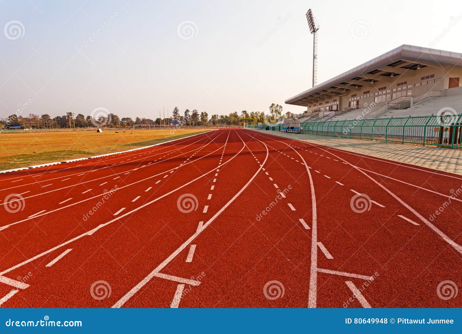 Red running track stock photo. Image of pace, game, compete - 80649948