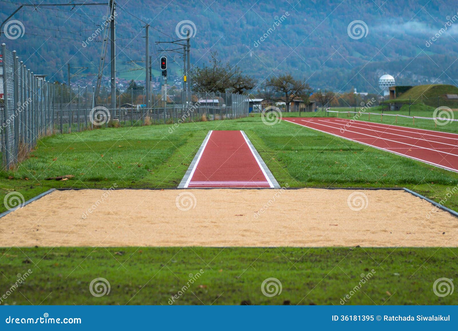 Red running track stock image. Image of healthy, grass - 36181395