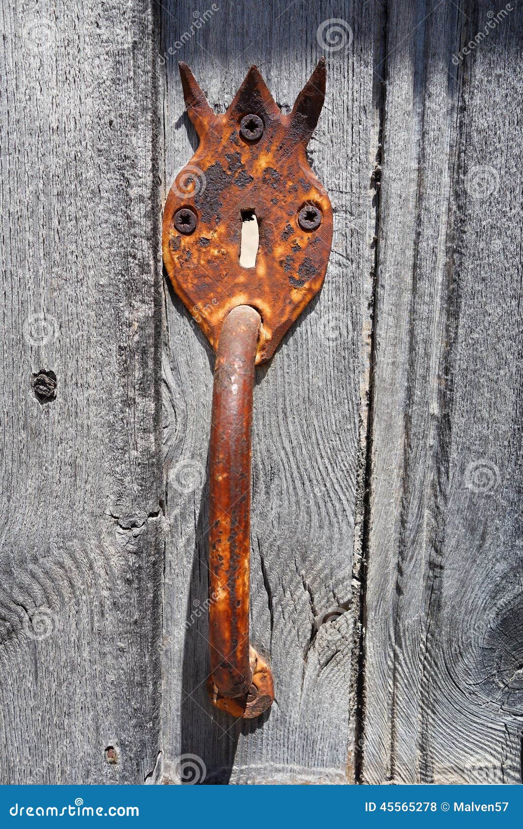 The Red Rusty Handle on an Old Board Stock Photo - Image of rusty ...
