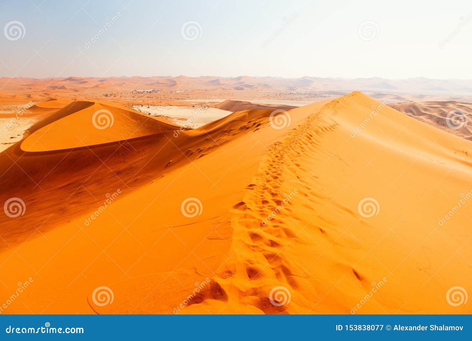 Red sand dunes of Namibia stock image. Image of areal - 153838077