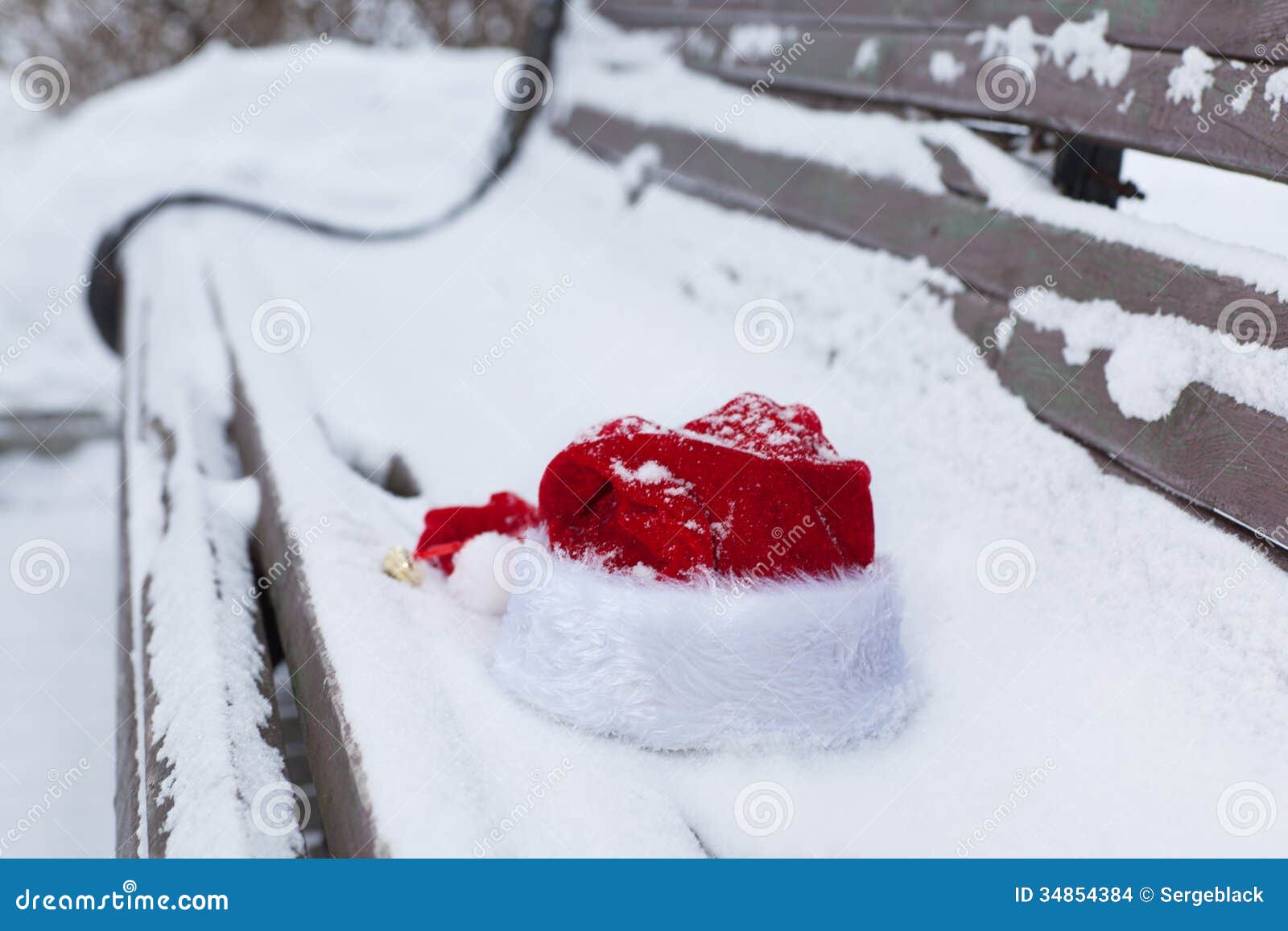 Red Santa Claus Hat on Bench with Snow Stock Photo - Image of furry ...