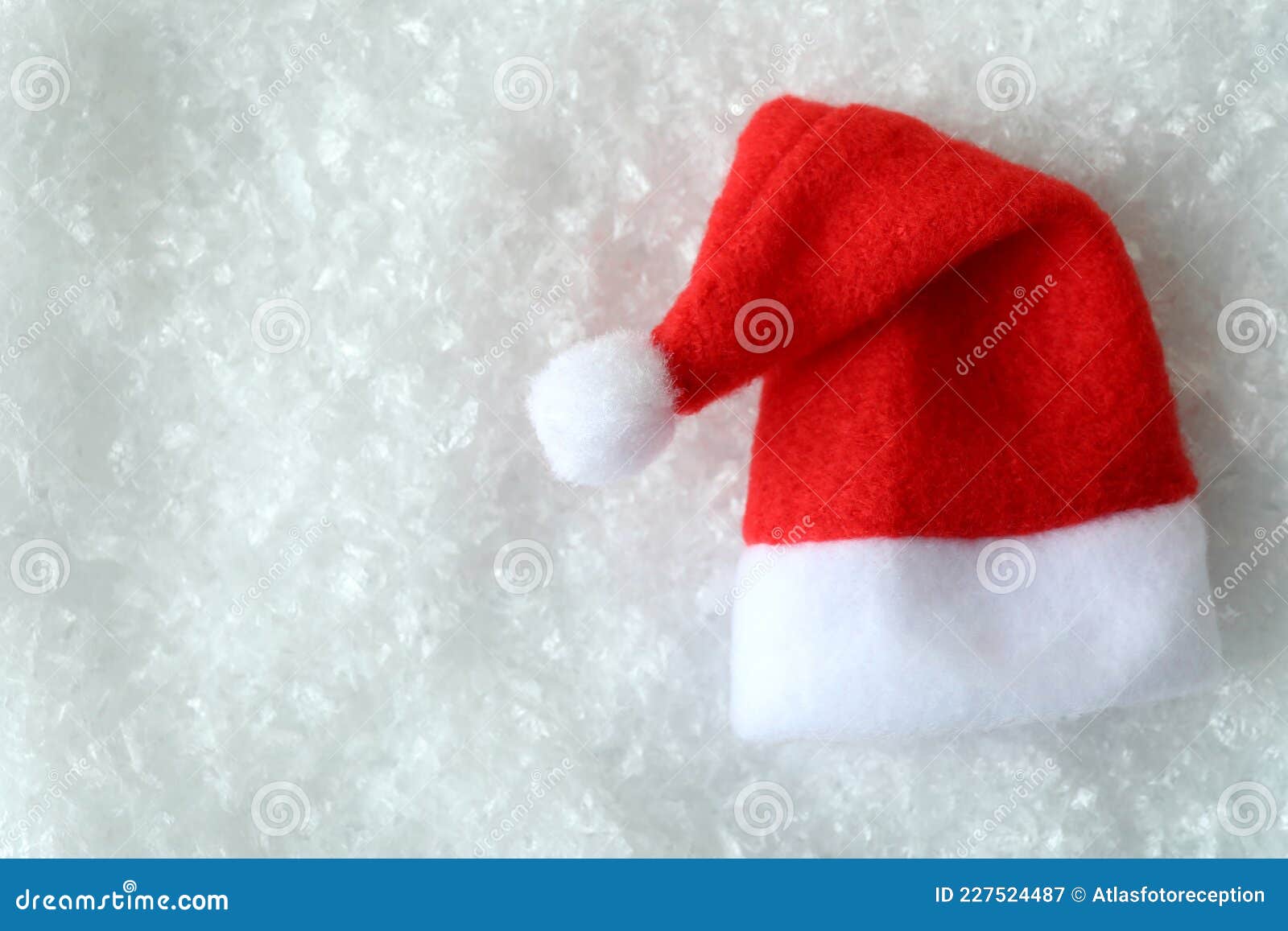 Red Santa Hat on Decorative Snow Background Stock Image - Image of ...