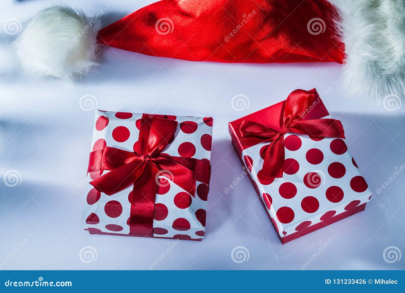 Red Santa Hat Wrapped Present Box on White Surface Stock Photo - Image ...