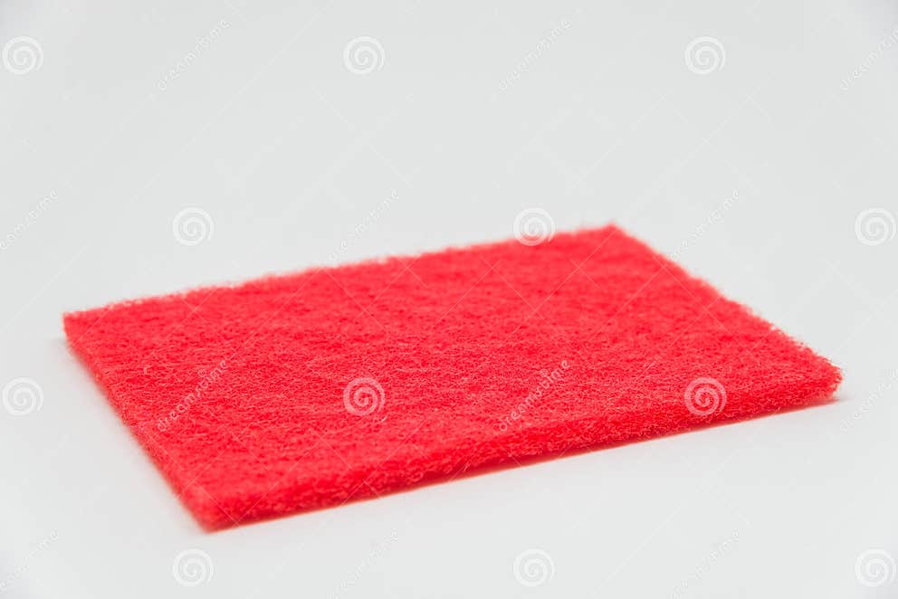 Red Scouring Pad with White Background and Selective Focus Stock Image ...