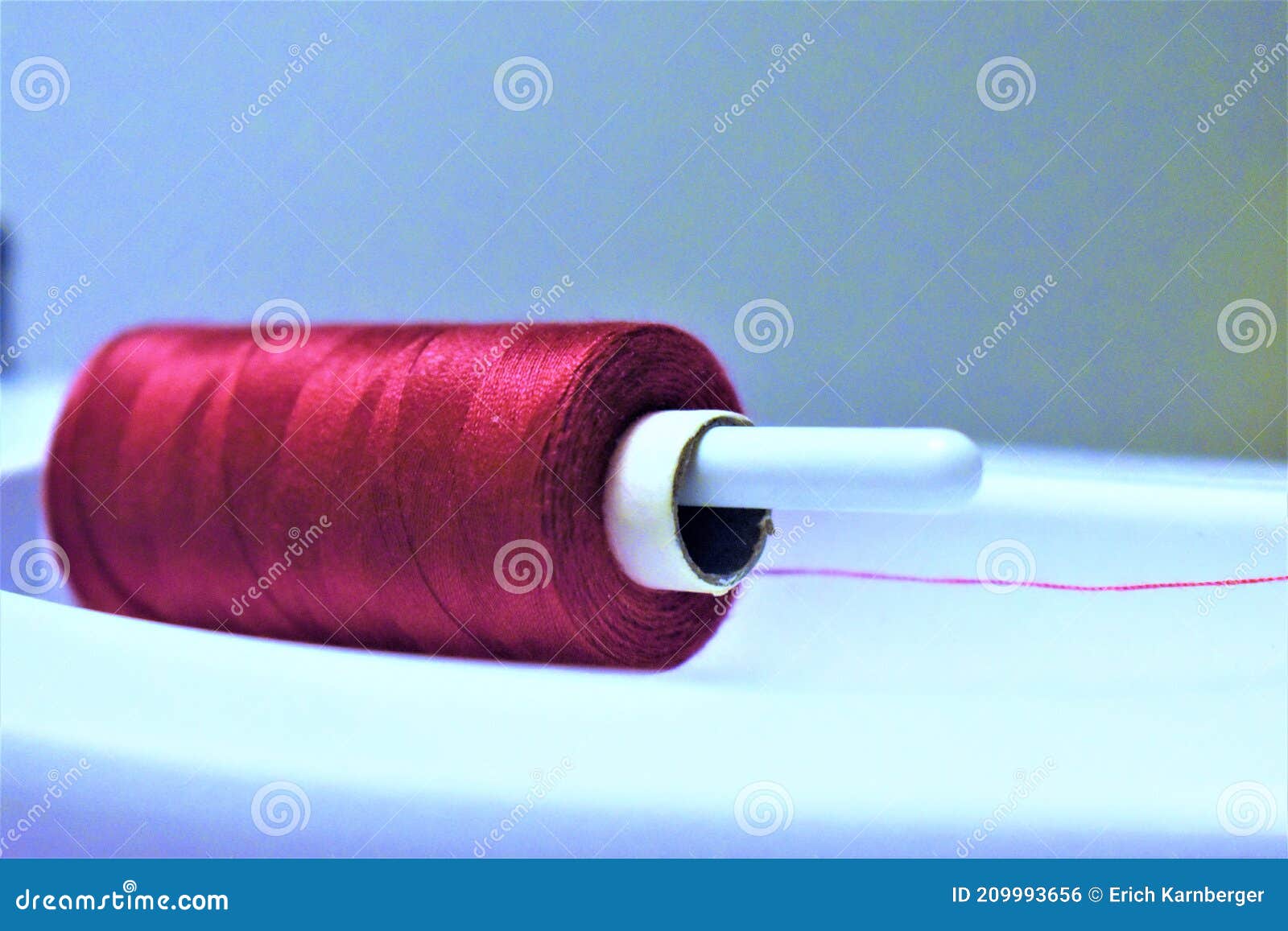 Red Sewing Thread on a Sewing Machine Stock Photo - Image of modern ...