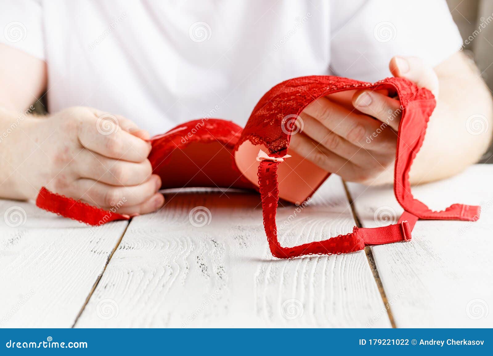 Red lace bra in hands stock photo. Image of breast, lingerie - 179221022