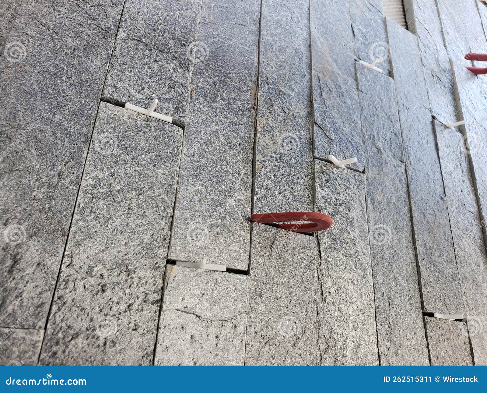 Red Shims for Tile Installation in the Wall Stock Image - Image of ...