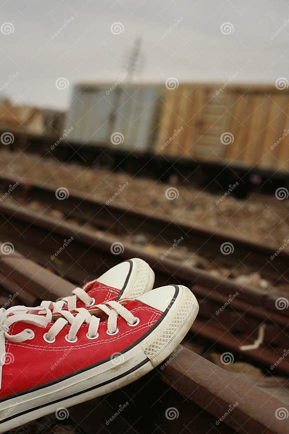 Red Shoes Leaning on the Train Tracks. Stock Image - Image of concept ...