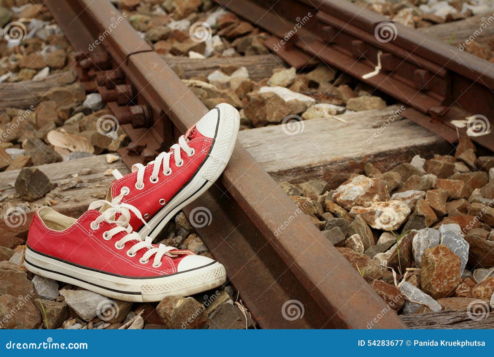 Red Shoes Leaning on the Train Tracks. Stock Image - Image of station ...