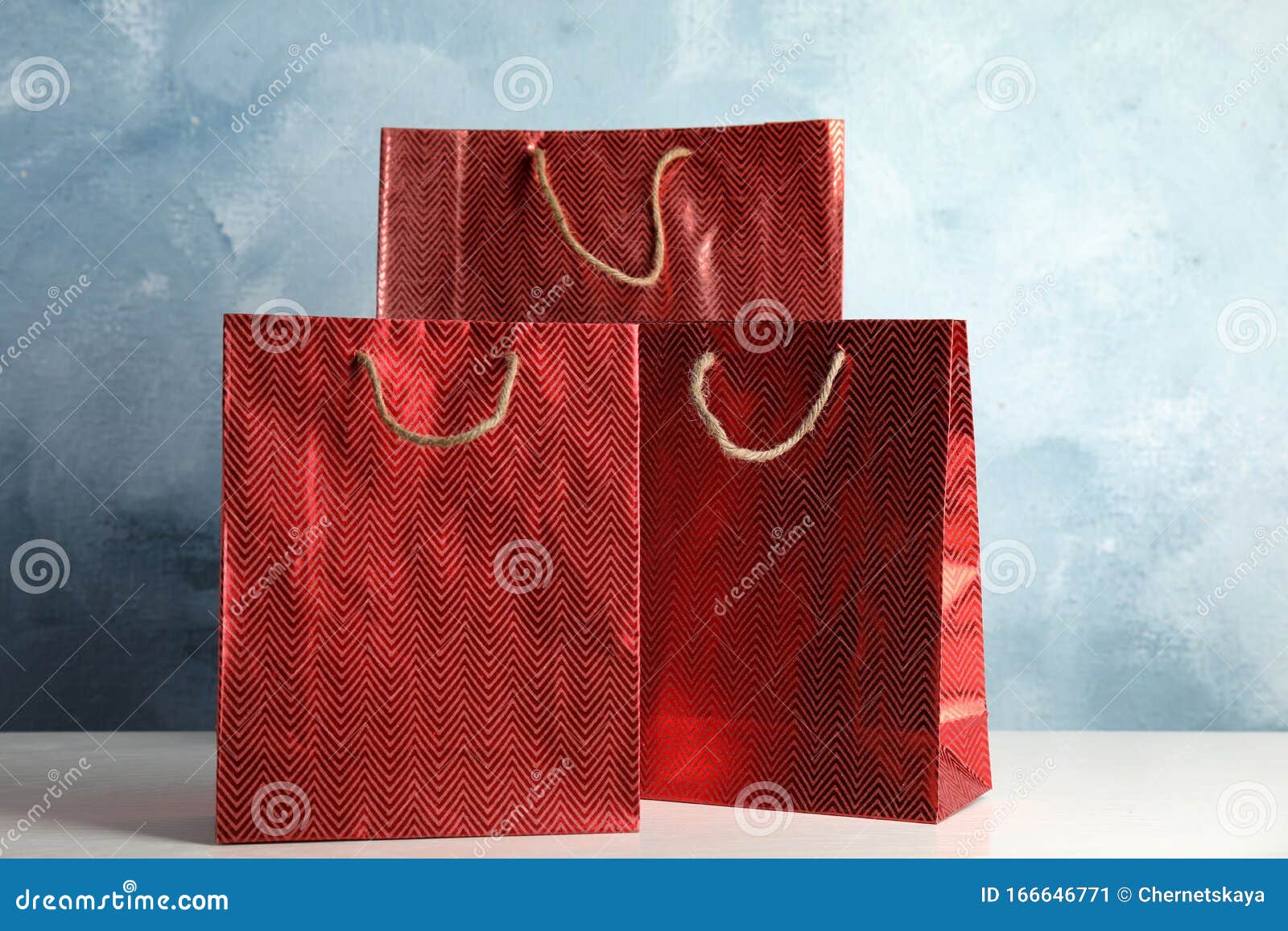 Red Shopping Paper Bags on Table Stock Image - Image of origami, empty ...