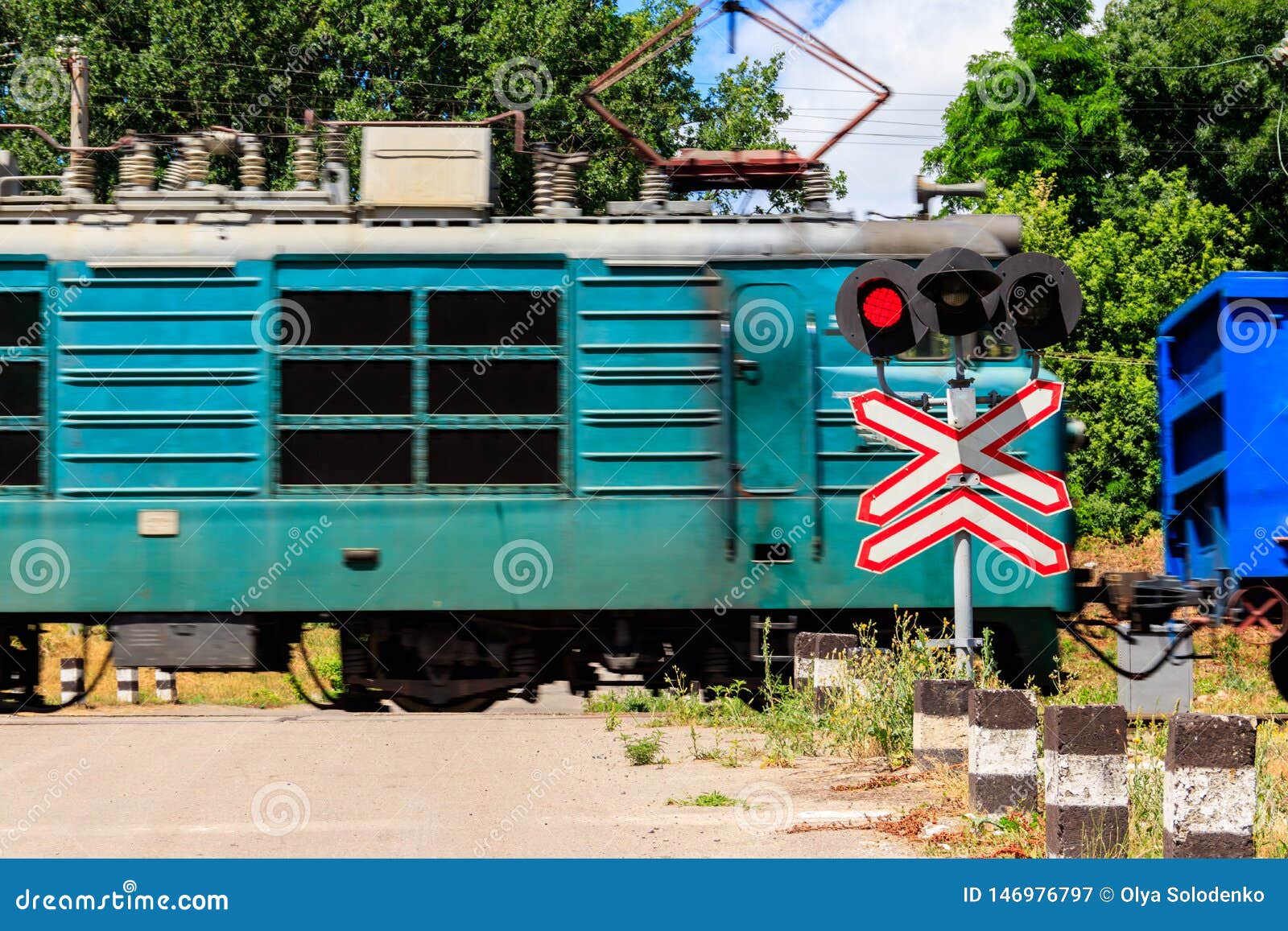 Red Signal of Semaphore and Stop Sign in Front of Railroad Crossing ...