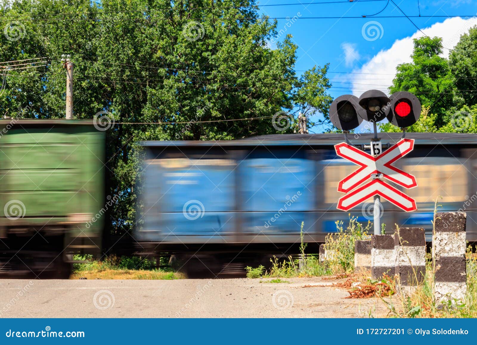 Red Signal of Semaphore and Stop Sign in Front of Railroad Crossing ...