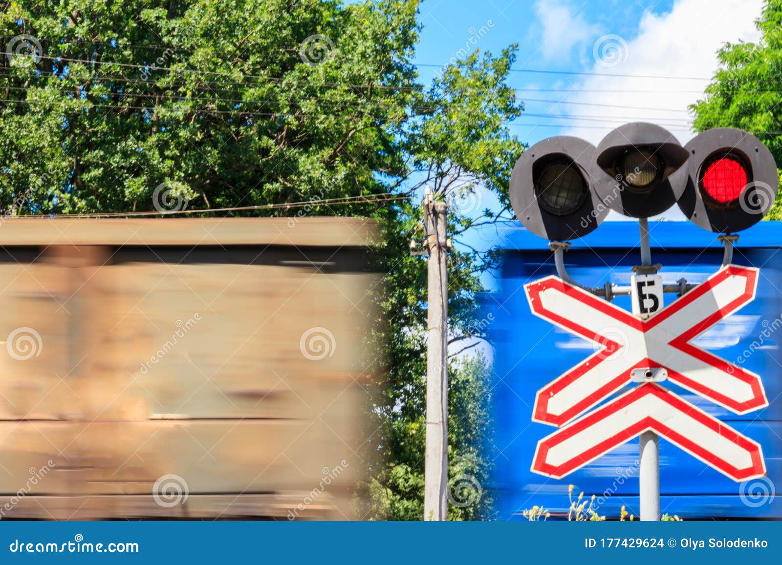 Red Signal of Semaphore and Stop Sign in Front of Railroad Crossing ...