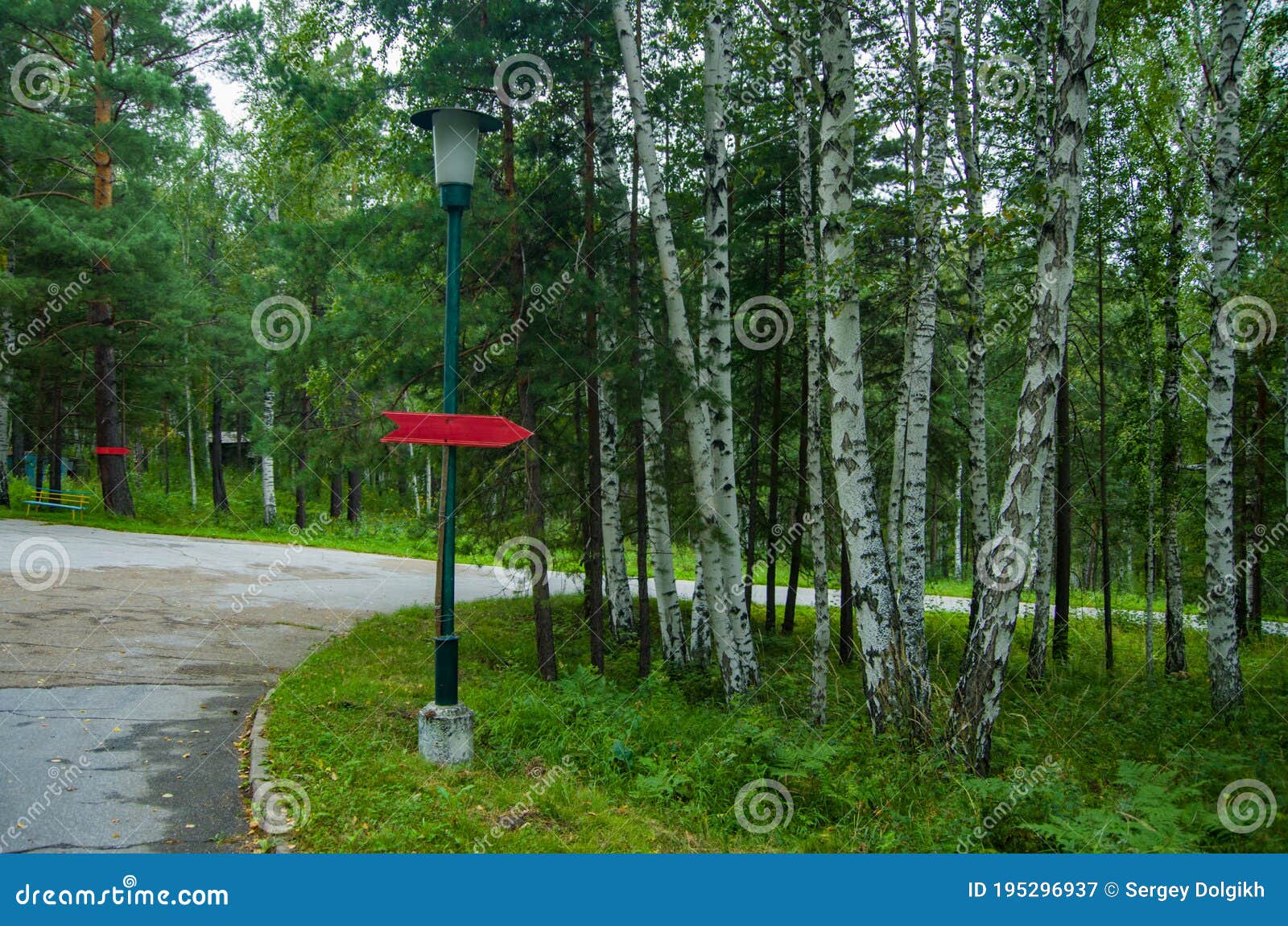 Red Signpost in the Park Indicates the Direction Stock Image - Image of ...