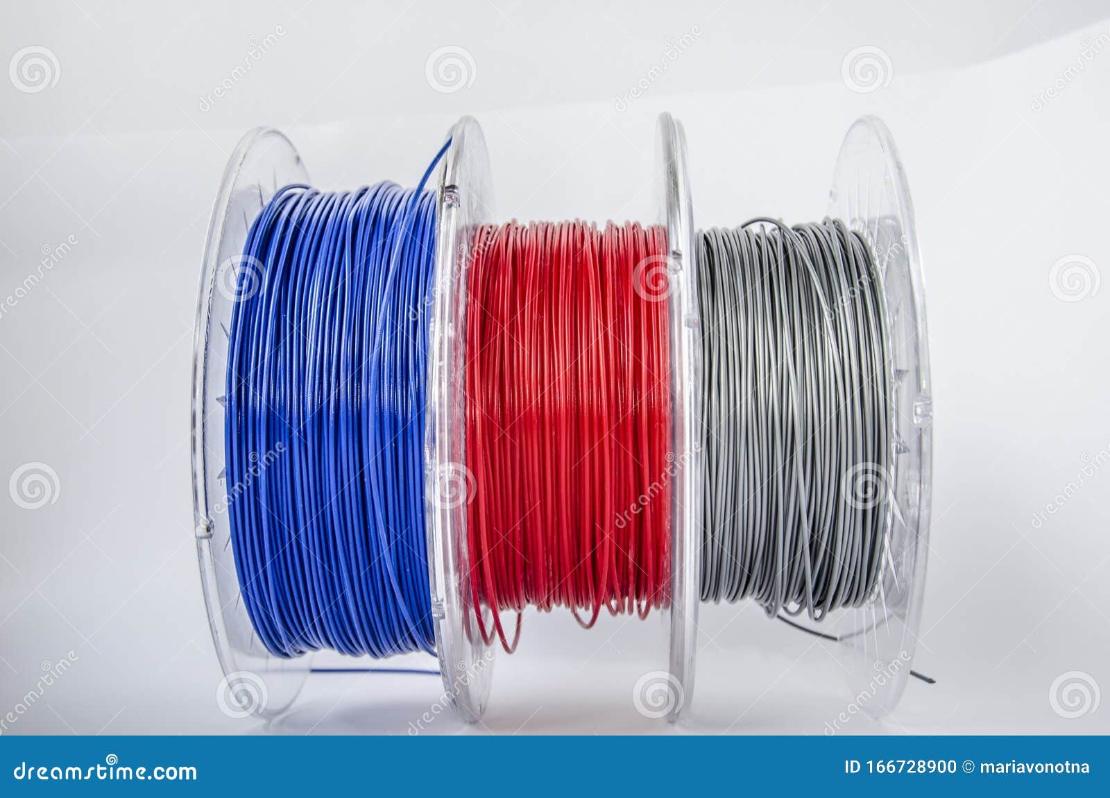 Red, Silver and Blue Filament Plastic for 3D Printing Stock Photo ...