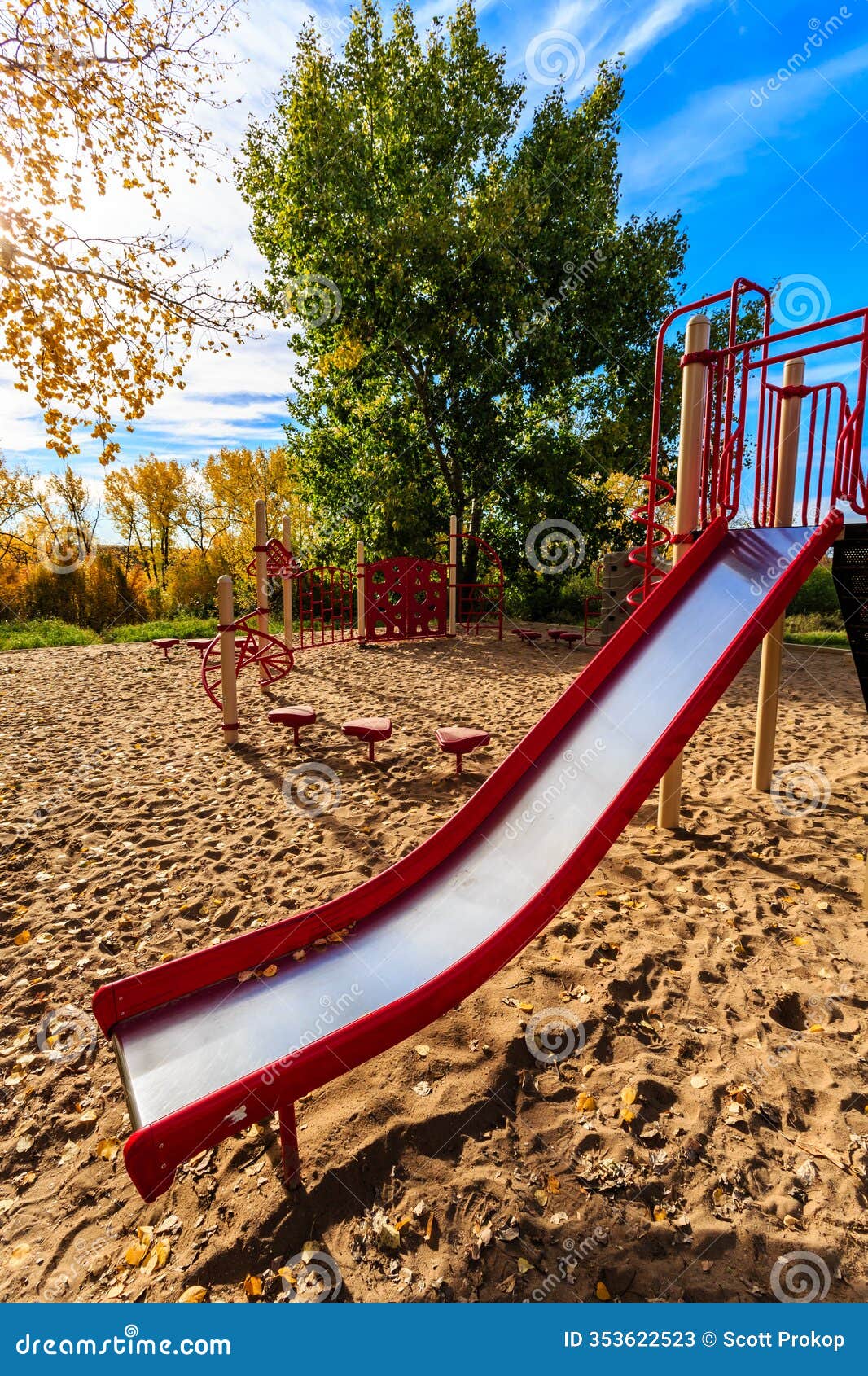 A Red and Silver Playground Slide is in a Park Stock Image - Image of ...