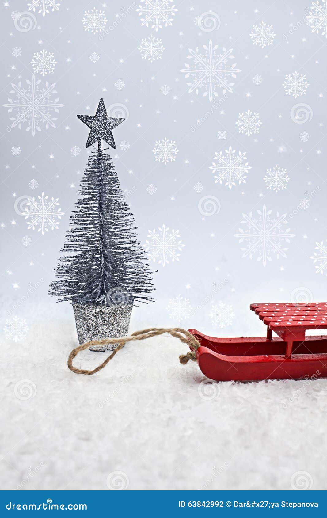 Red Sled and Ornamental Tree Stock Photo - Image of artificial ...