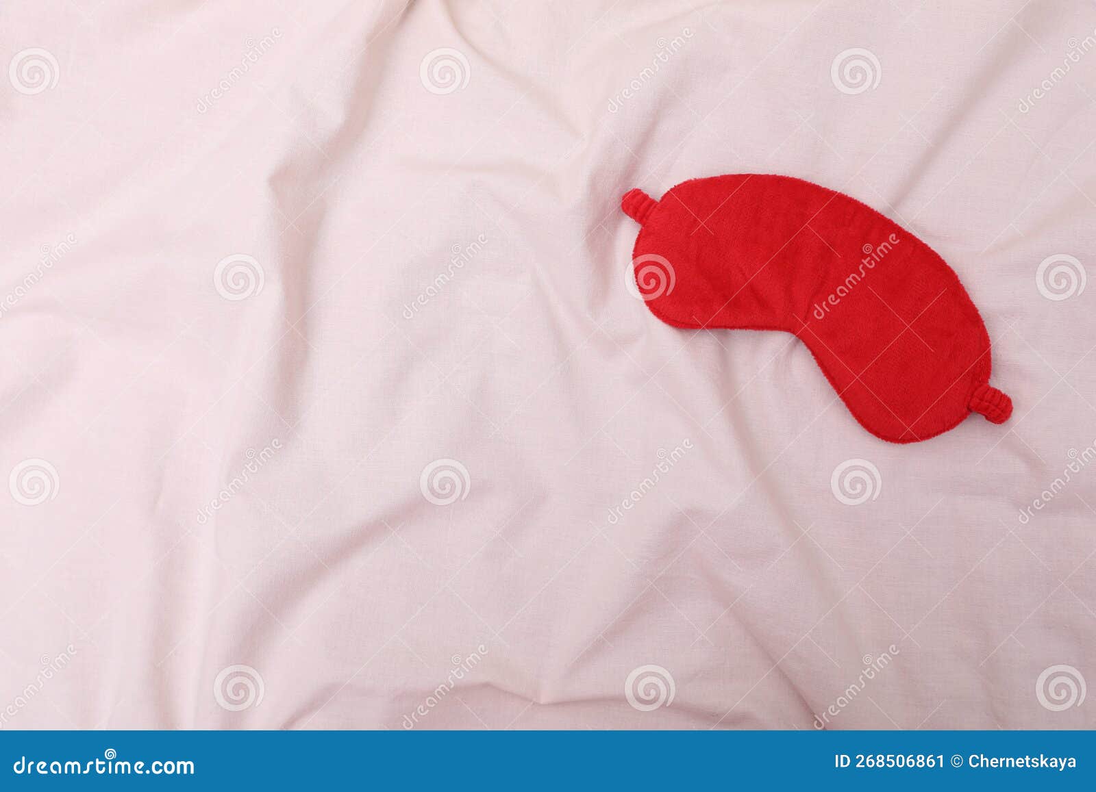 Red Sleep Mask on Beige Cloth, Top View. Space for Text Stock Image ...