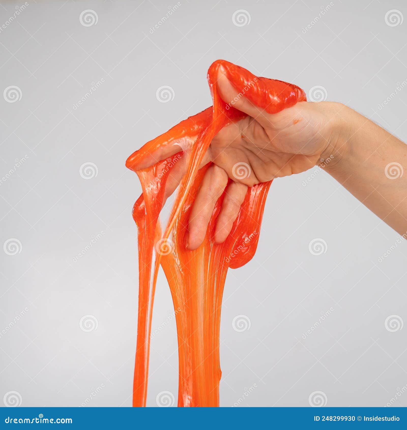 Red Slime Flowing Down from a Woman S Hand on a White Background. Stock ...